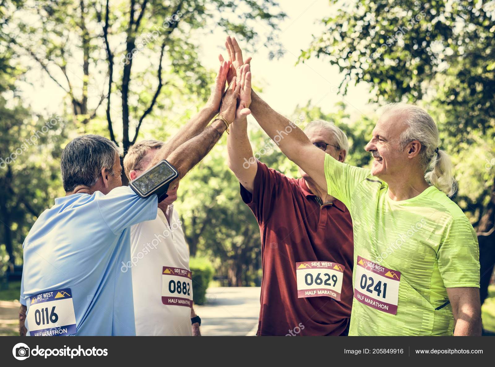 Group Senior Athletes Giving High Five — Stock Photo © Rawpixel #205849916