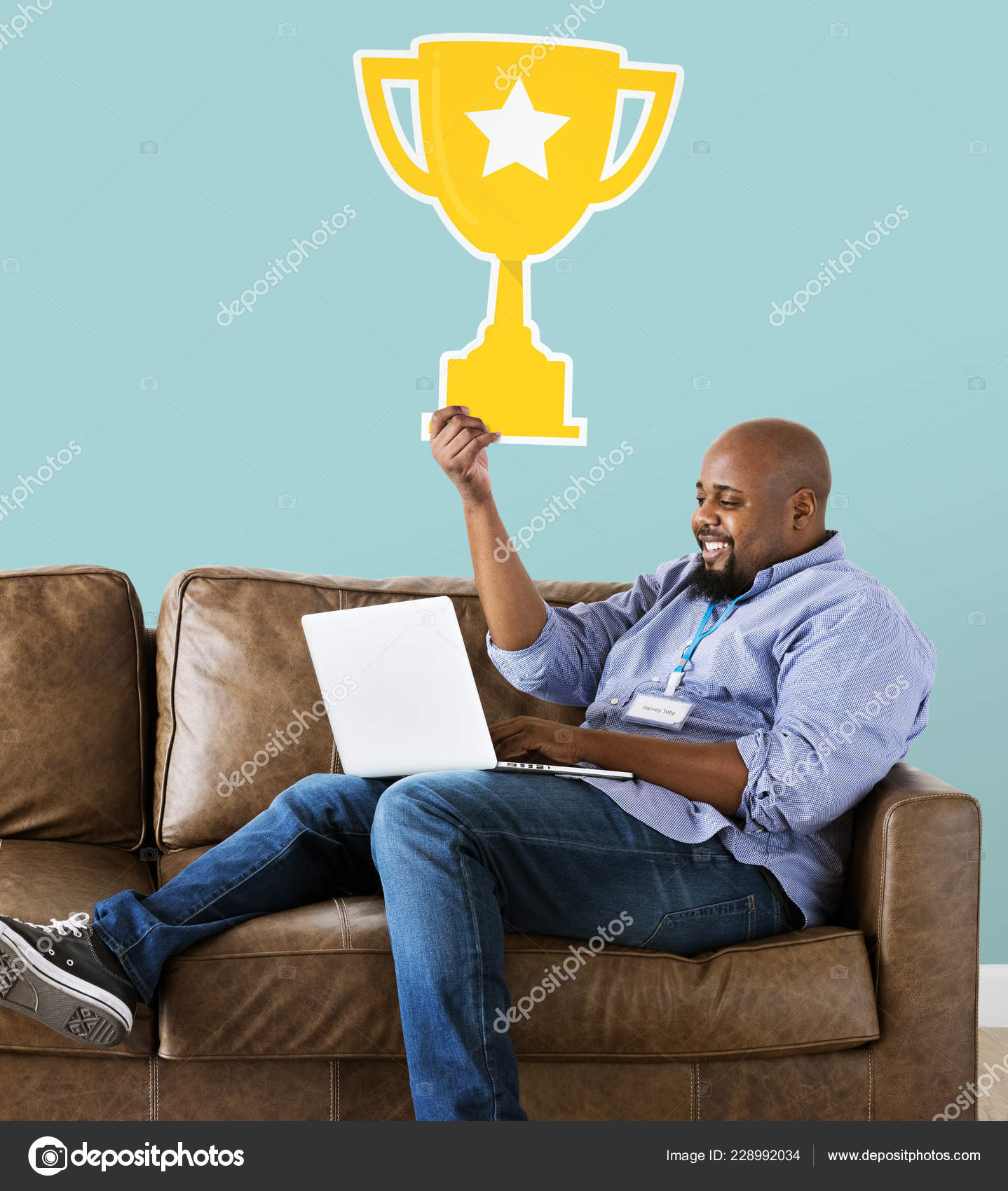 Man Showing Trophy Icon Couch — Stock Photo © Rawpixel #228992034