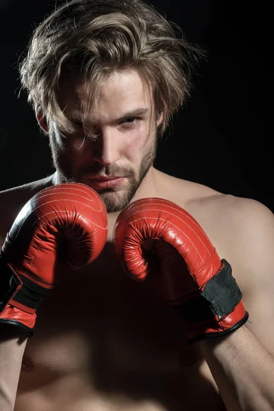 Professional boxer are fighthing isolated in black background. Portrait ...