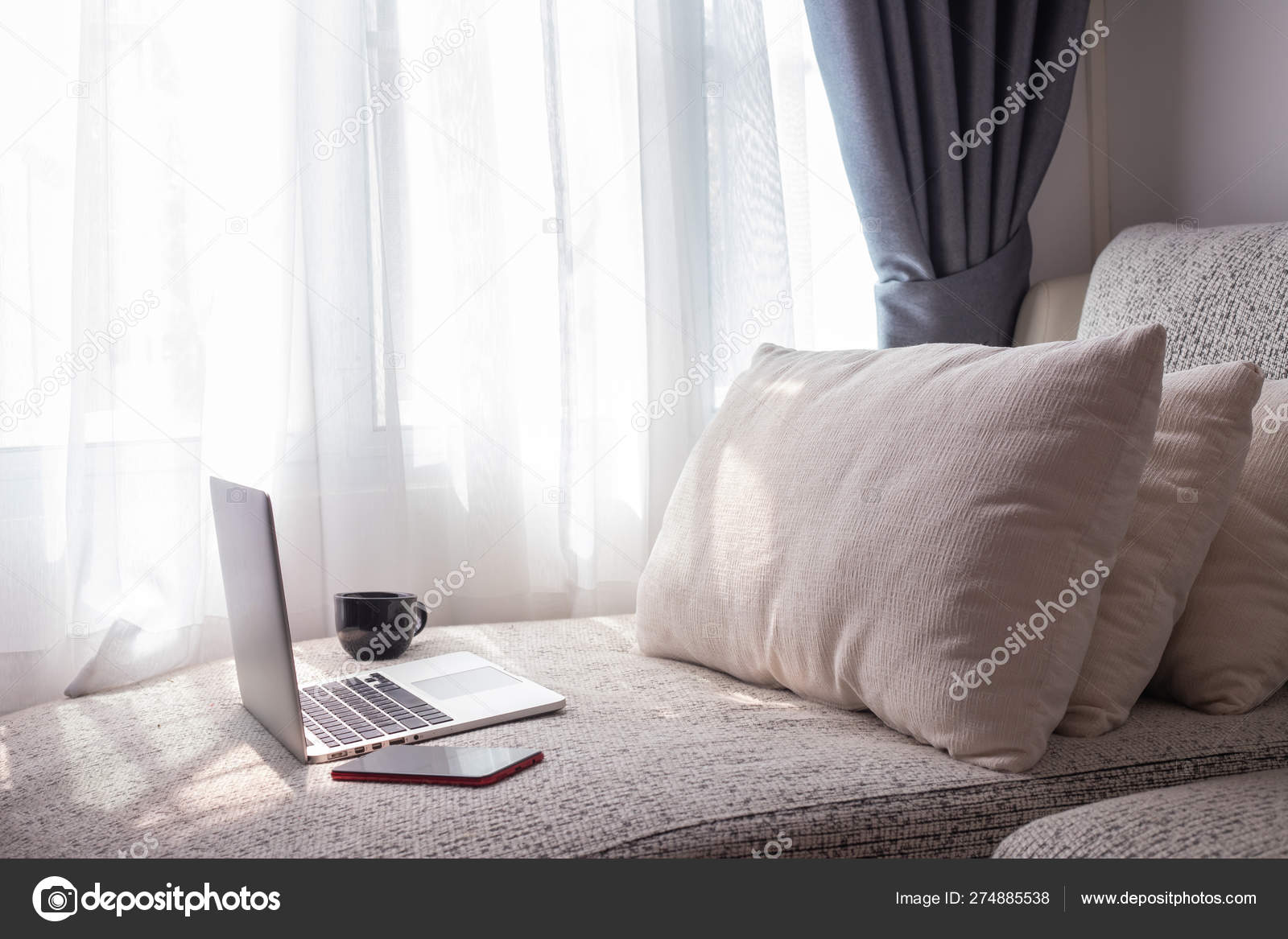 White bed with blank screen on laptop and alarm clock in bedroom Stock ...