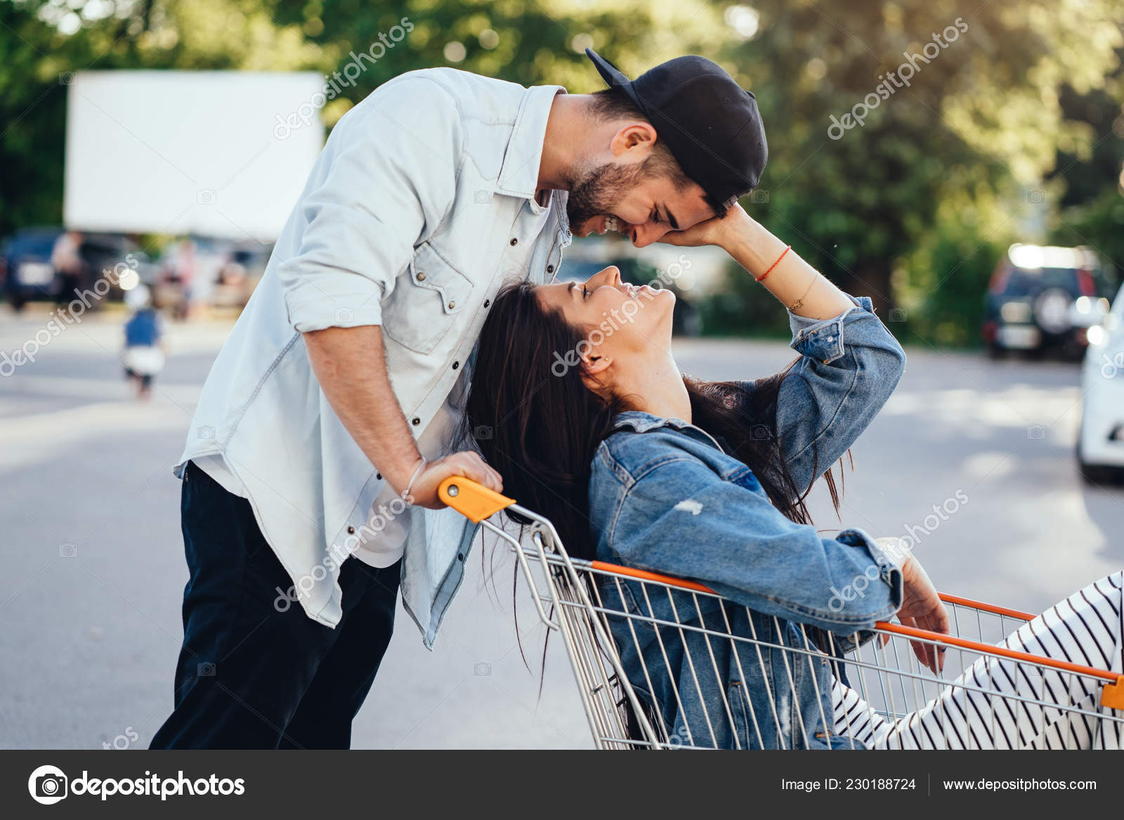 Handsome Guy Carries His Girlfriend In Cart Guy Kisses His Girlfriend