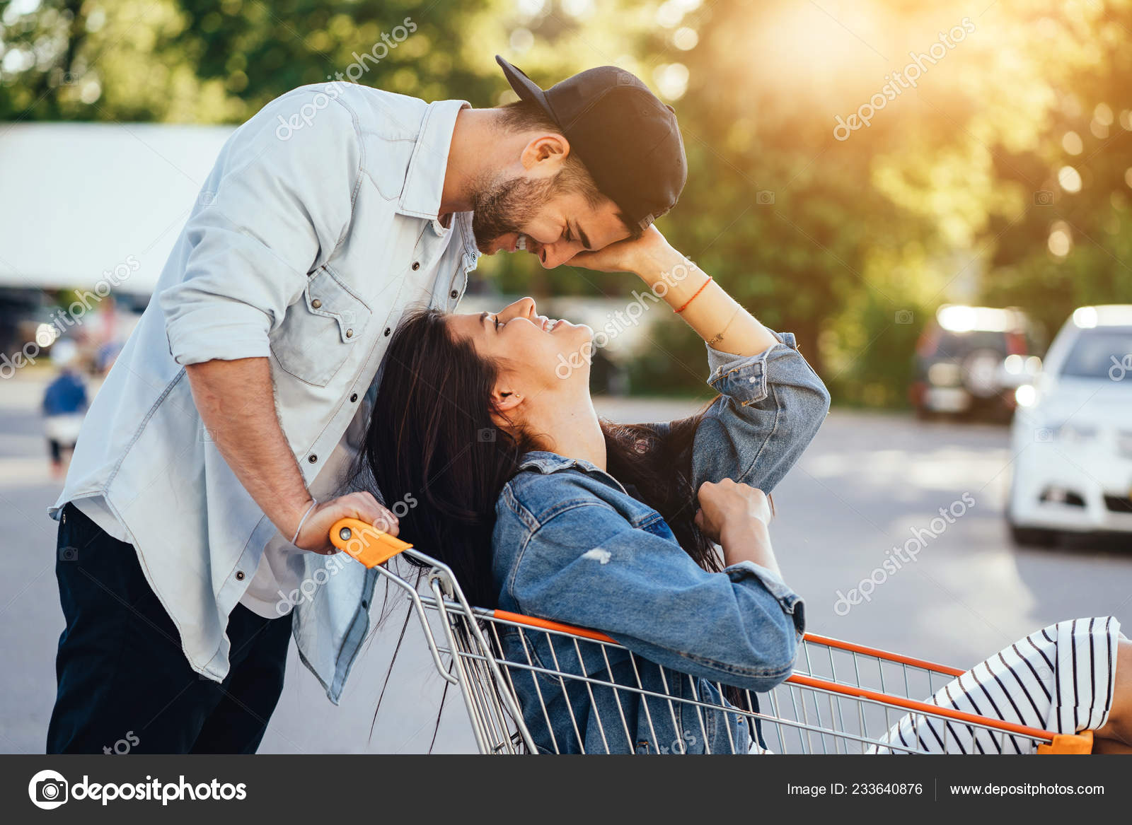 Handsome Guy Carries His Girlfriend In Cart Guy Kisses His Girlfriend