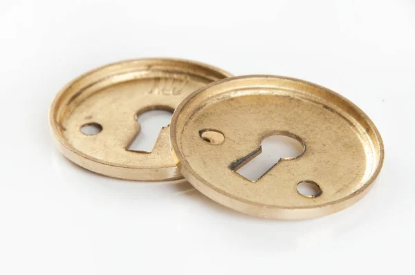 Vintage brass keyhole lock covers Stock Photo by ©voisine 251908013