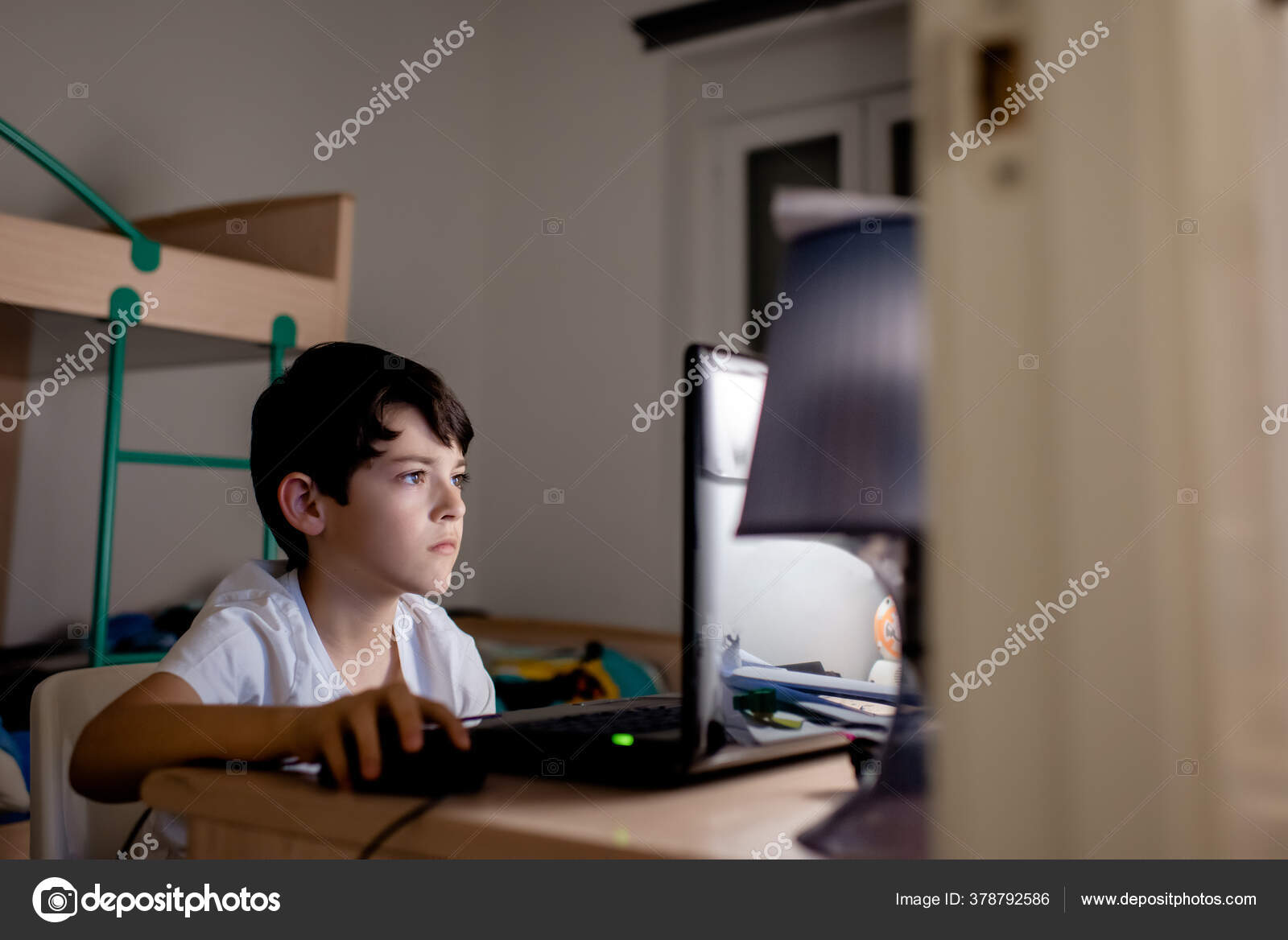 A boy using a laptop in his workspace — Stock Photo © juangarciarisquez ...