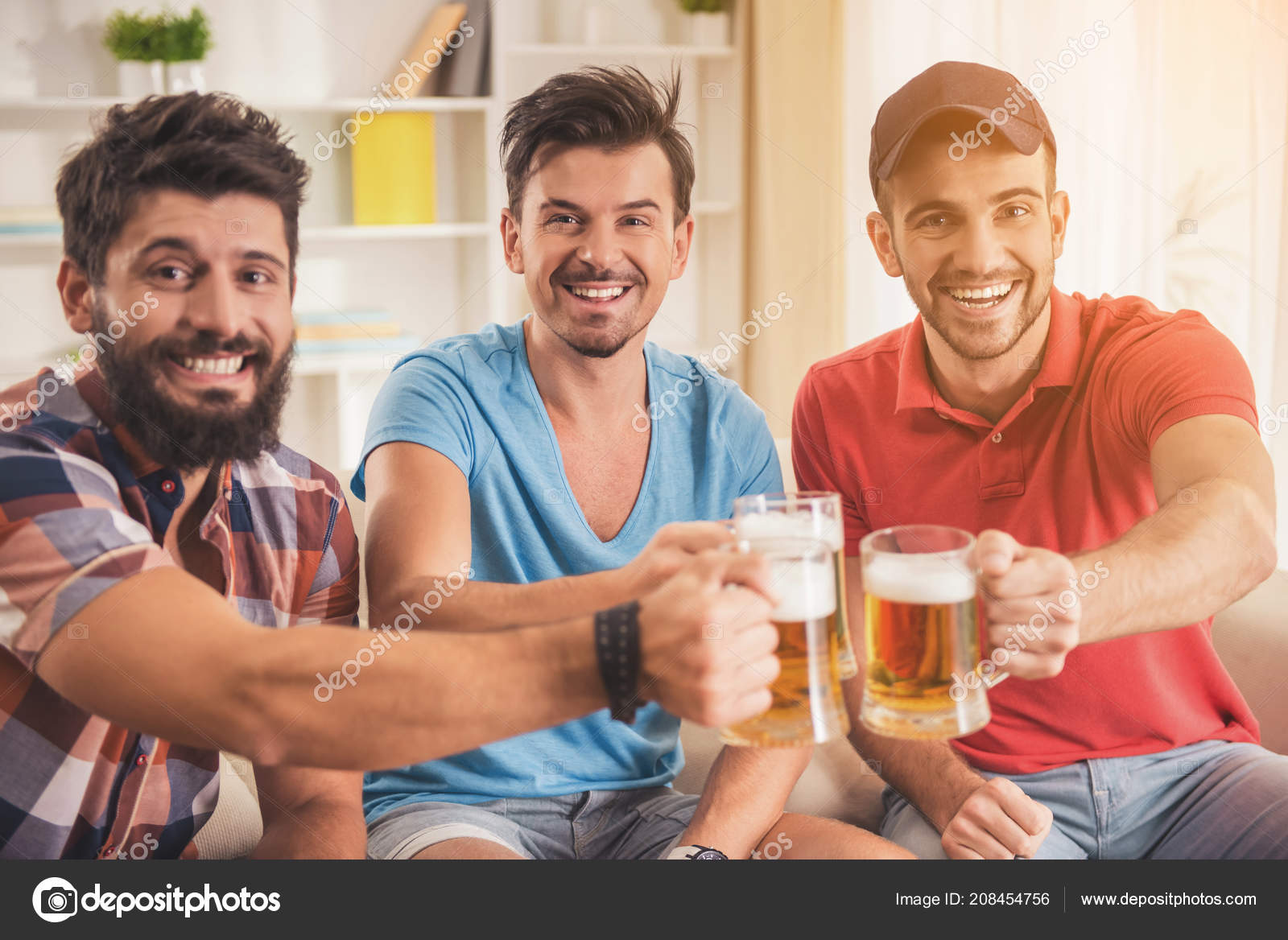 Three Young Men Drinking beer on Party at Home Stock Photo by ...