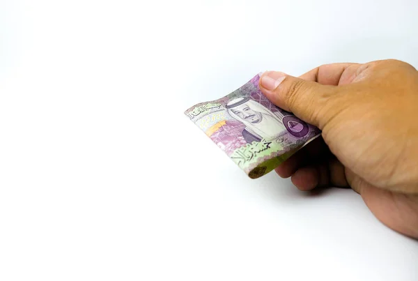 Hand holding Indian New 100 rupee notes on isolated background Stock ...