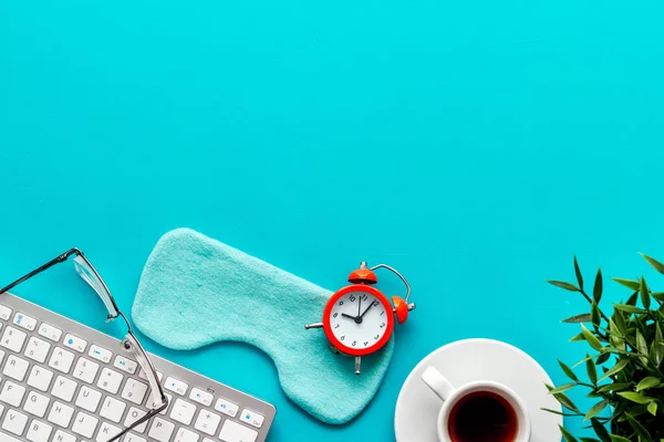 Sleeping on office desk. Concept with sleep mask and laptop top-down ...