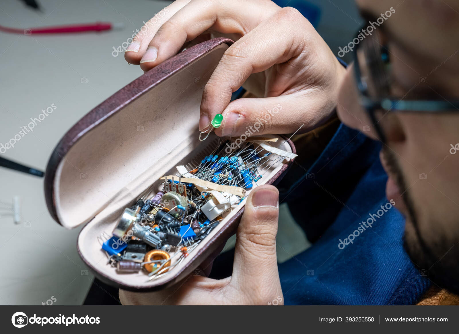 Guy Holding Electronic Parts His Hand — Stock Photo © dieasaob #393250558