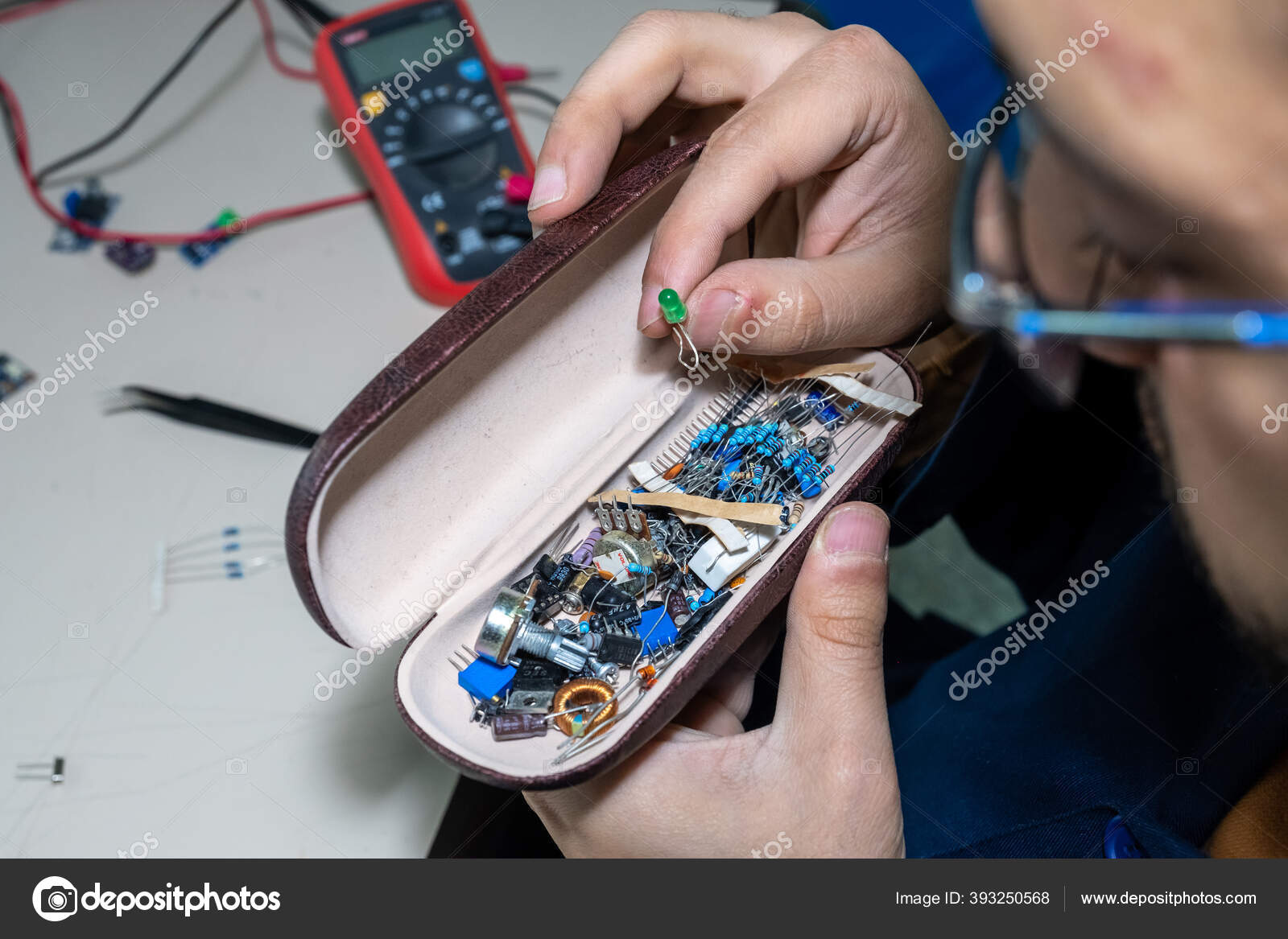 Guy Holding Electronic Parts His Hand — Stock Photo © dieasaob #393250568