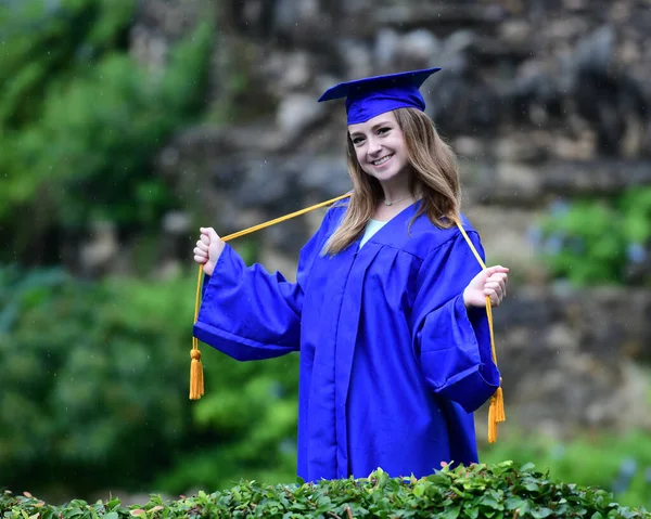 Young Female High School Senior posing for Senior photos in a beautiful ...