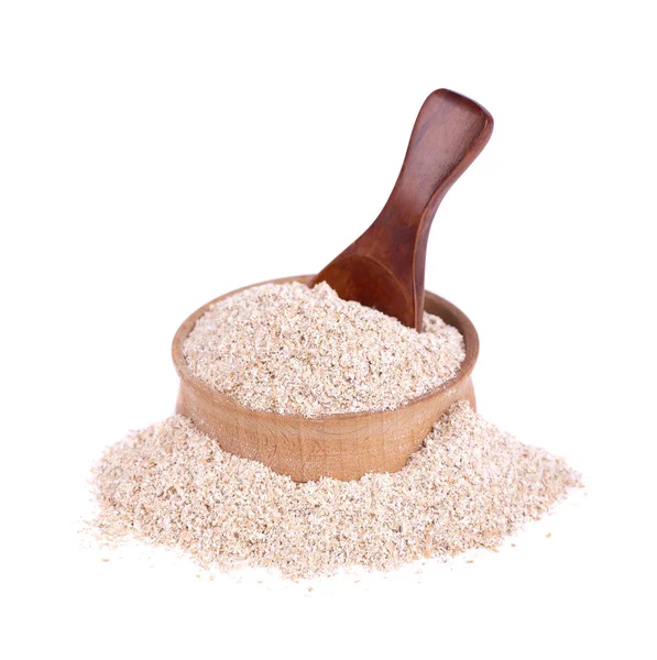 Wheat bran in a small wooden bowl, isolated on white. Wheat germ, the ...