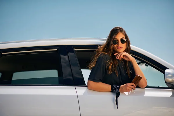 Woman Posing While Leaning Car Window Stock Photo by ©chika_milan 204307200