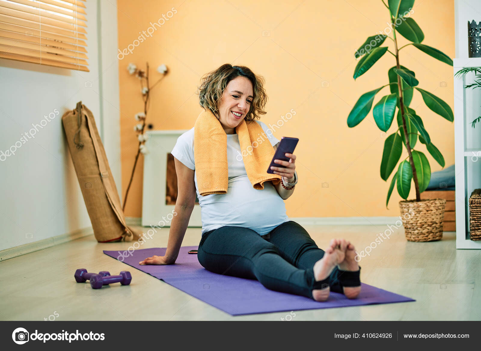 Attractive Middle Aged Pregnant Yogi Woman Sitting Mat Using Smart