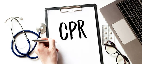 CPR cardiopulmonary resuscitation text in the paper plate and doctor's ...