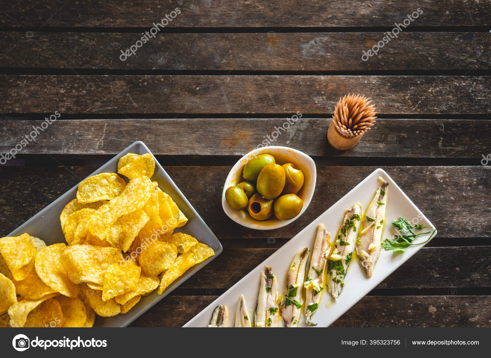 Three Dishes Potato Chips Picked Anchovies Green Olives Dark Wooden ...