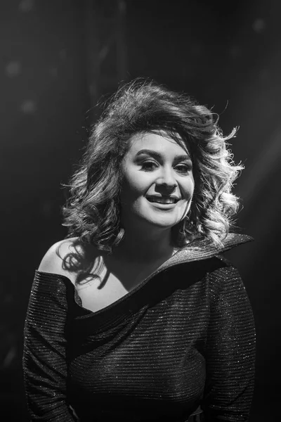 Young beautiful actress woman on stage under the spotlights. - Stock ...