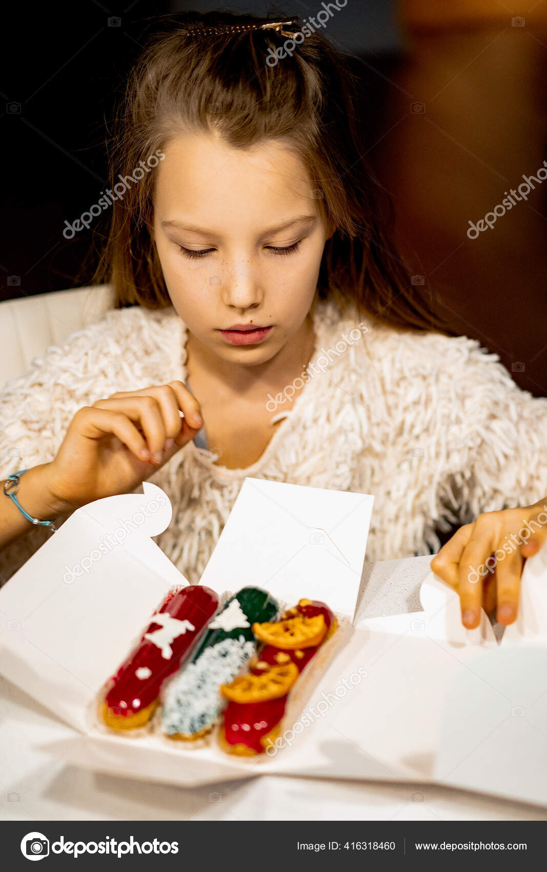 Girl Eating Beautiful Dessert Eclair — Stock Photo © Kireyonok #416318460
