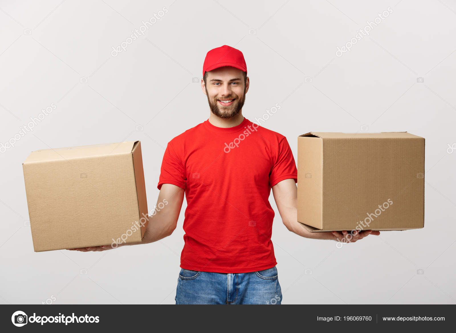 Delivery Concept: Portrait smiling delivery man giving cardbox on white ...