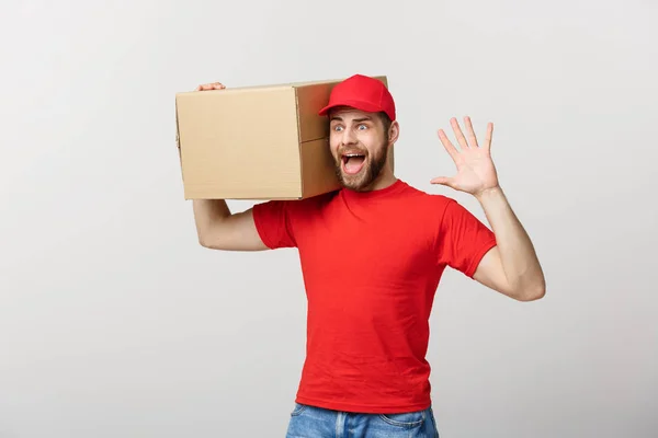 Shocked Delivery Man Red Uniform Holding Parcel Green Stock Photo by ...