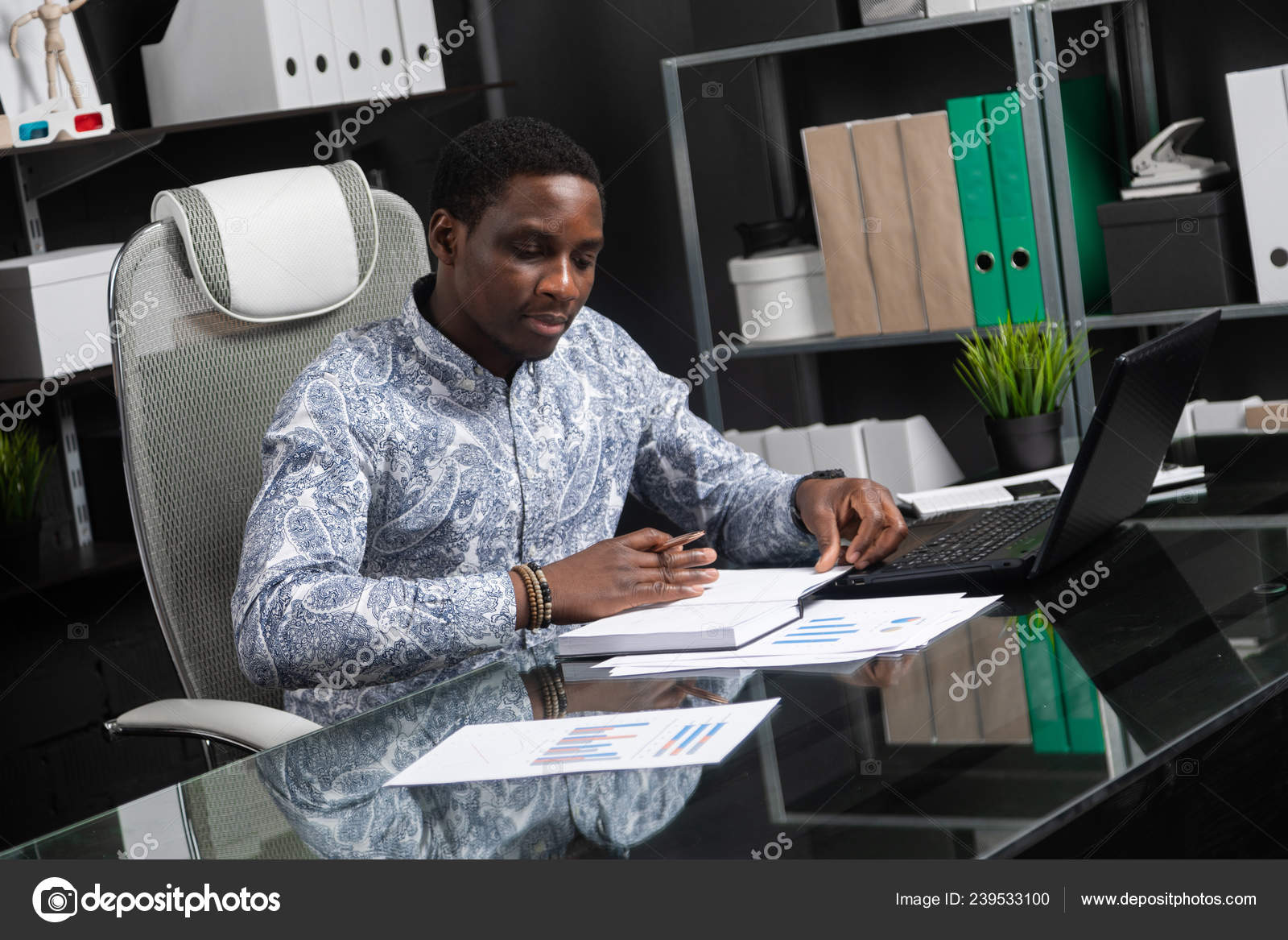 African American Businessman At Desk