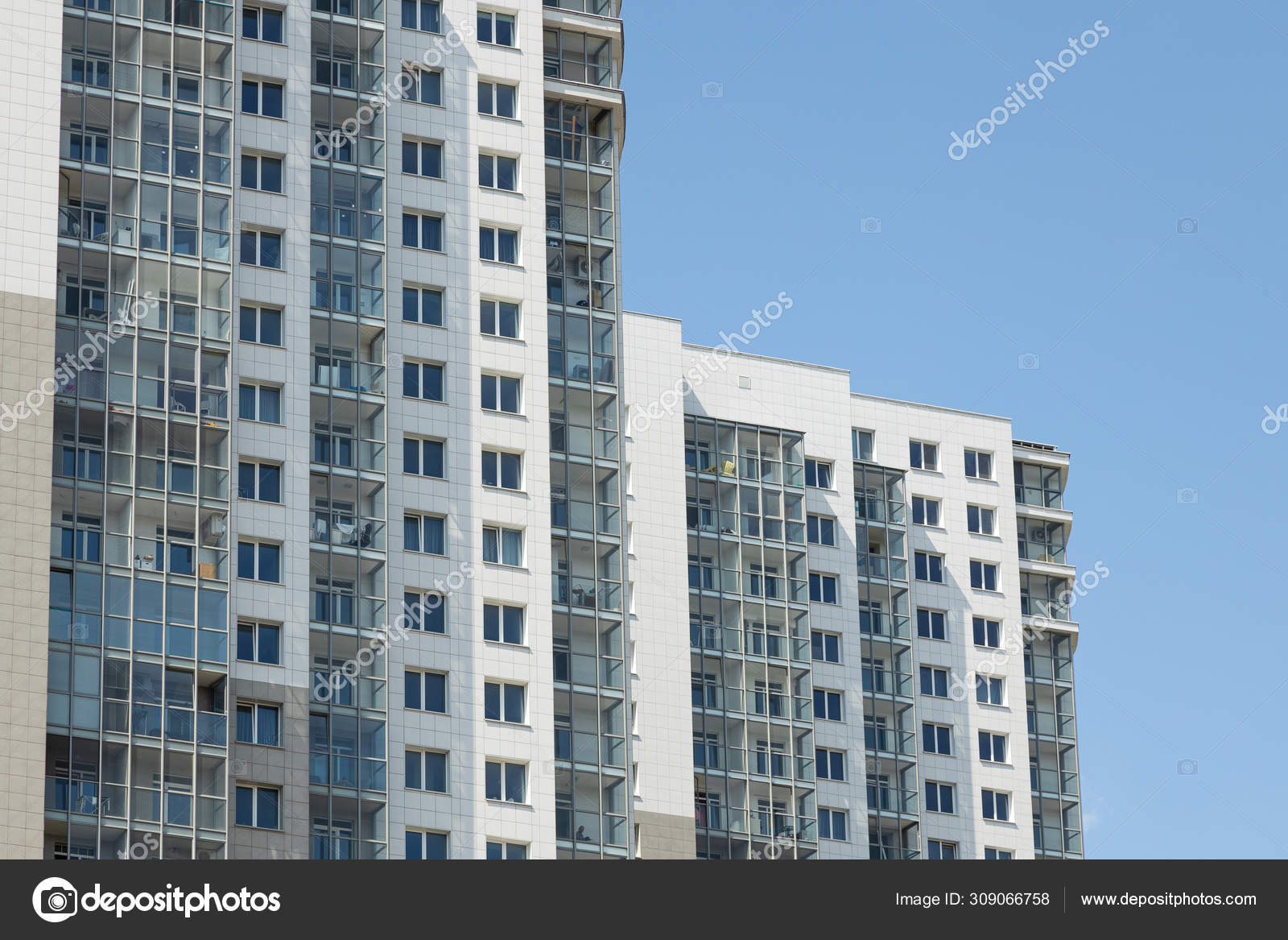 Modern high-rise apartment building at blue sky background Stock Photo ...