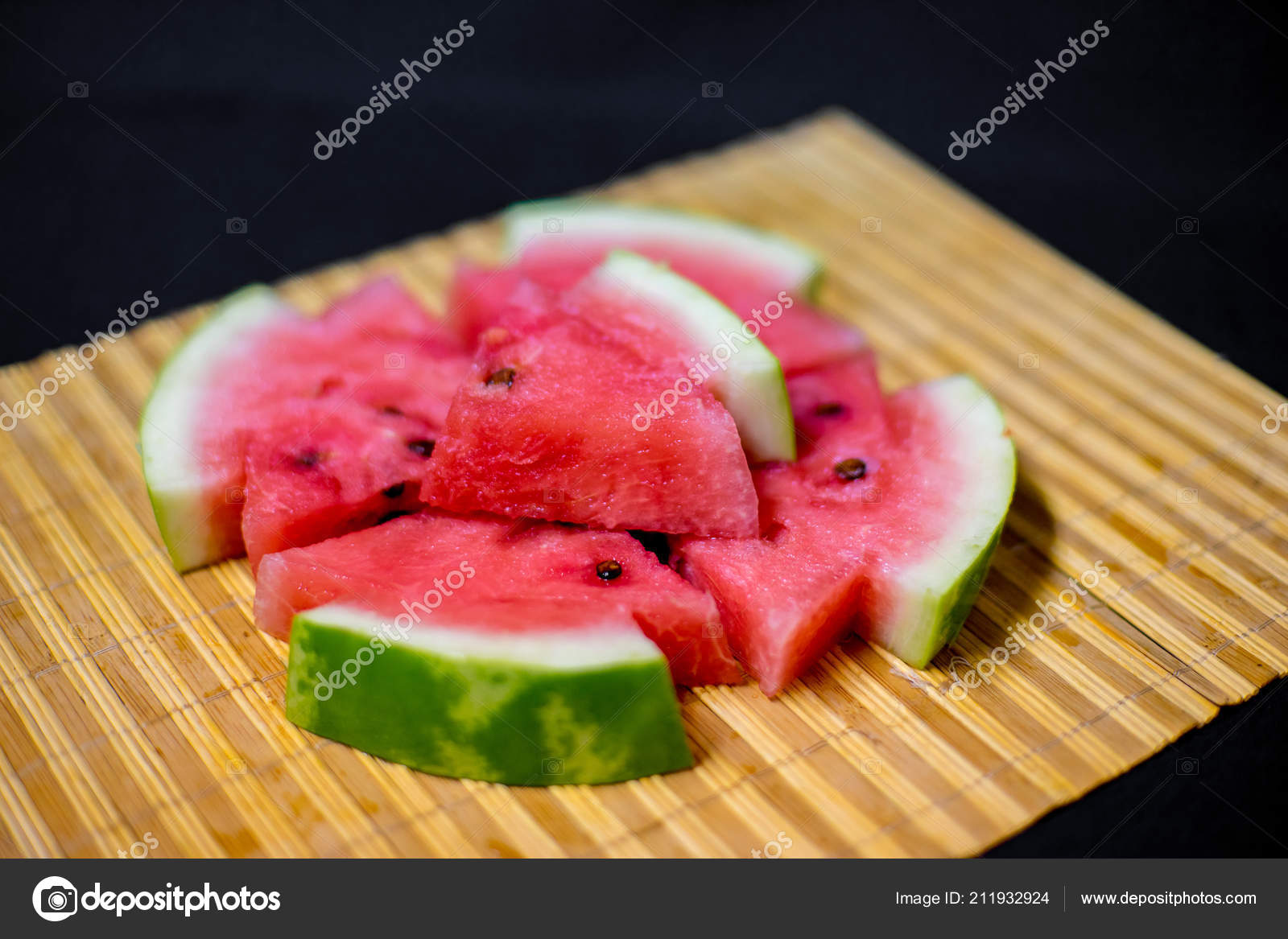 An image of a Fresh sliced red watermelon on a table — Stock Photo ...