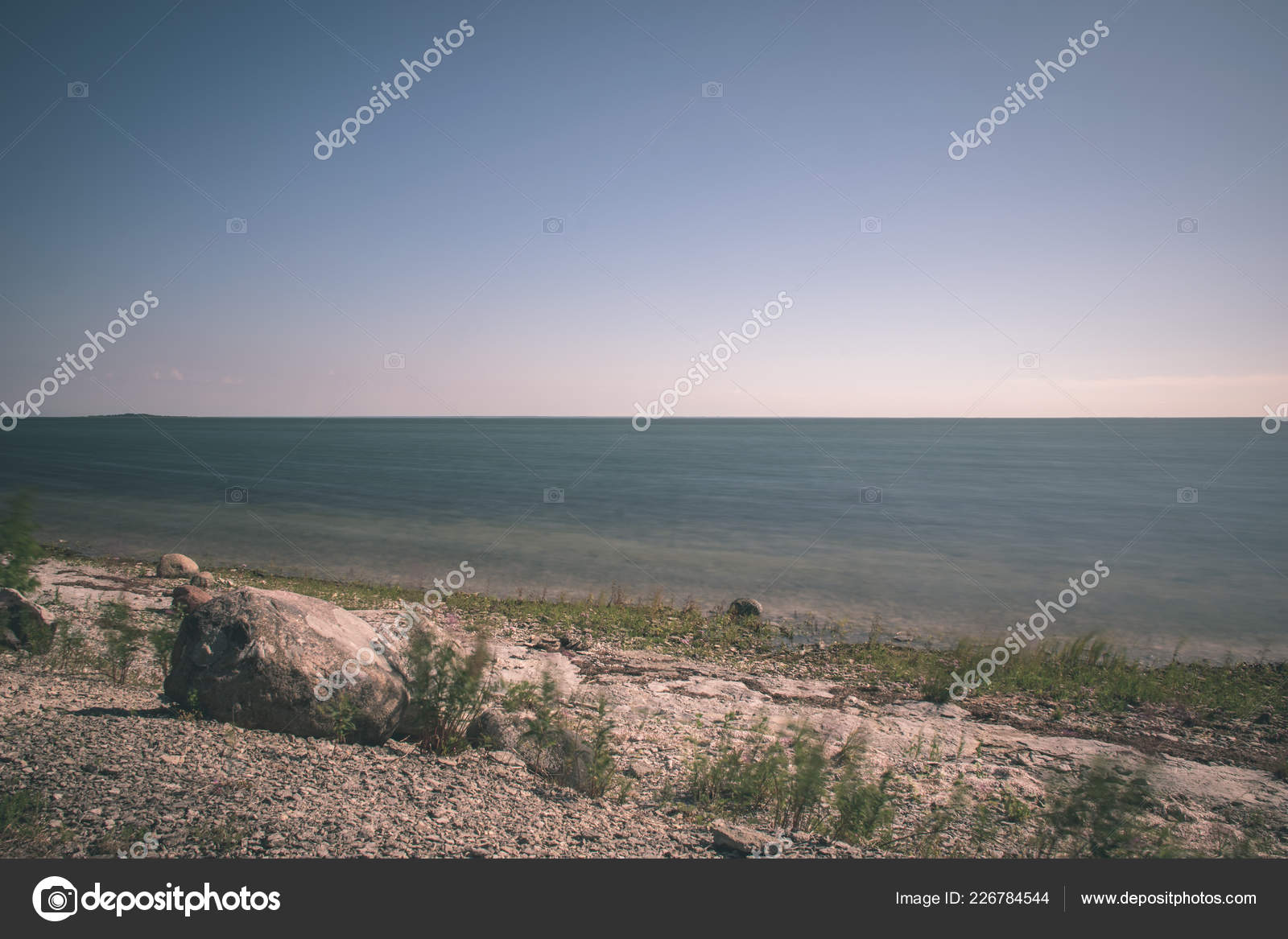 Scenic Shot Calm Seashore Pebbles — Stock Photo © martinsvanags #226784544