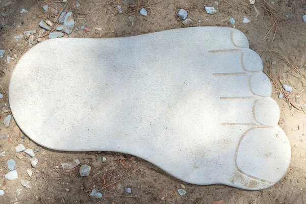 Close-up and flat lay big feet of concrete on the ground. Fun design ...