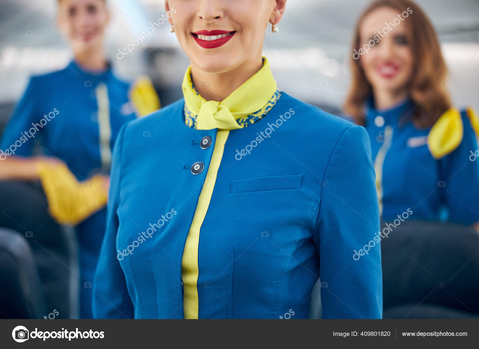 Charming female wearing air hostess suit on the board of commercial ...