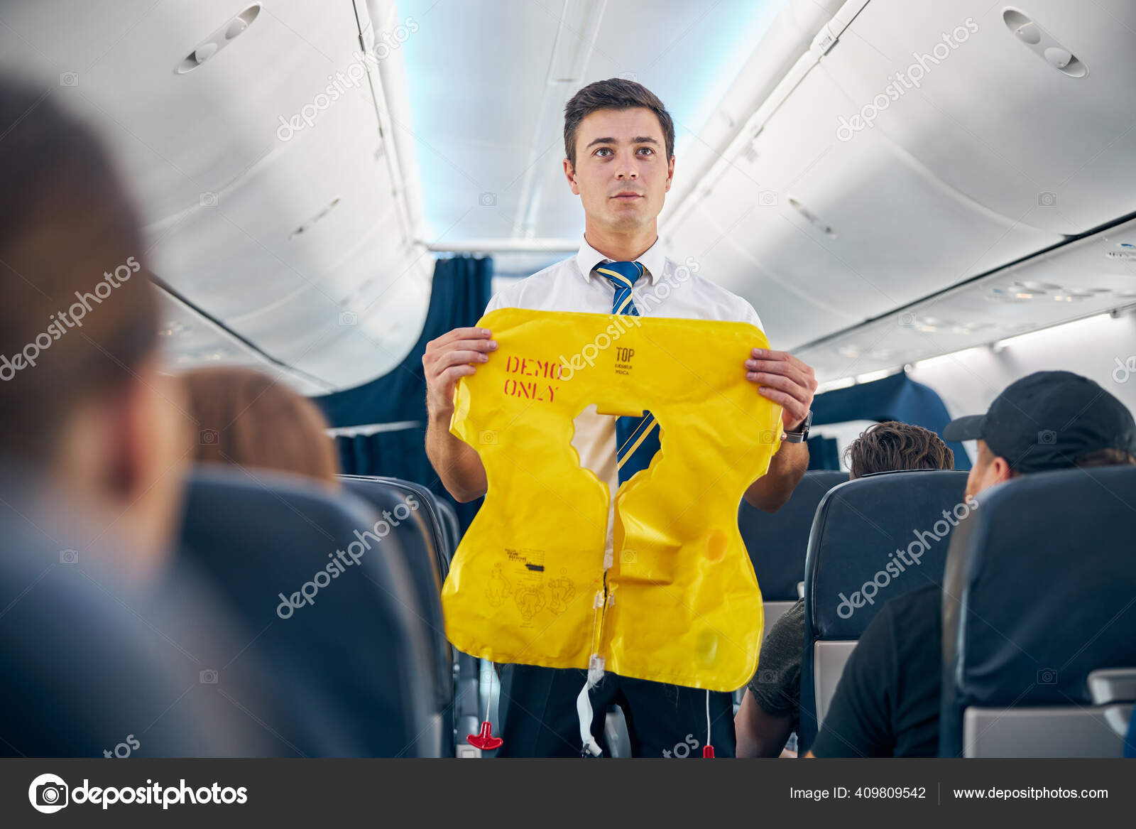 Steward demonstrating airplane rules for safety on board Stock Photo by ...