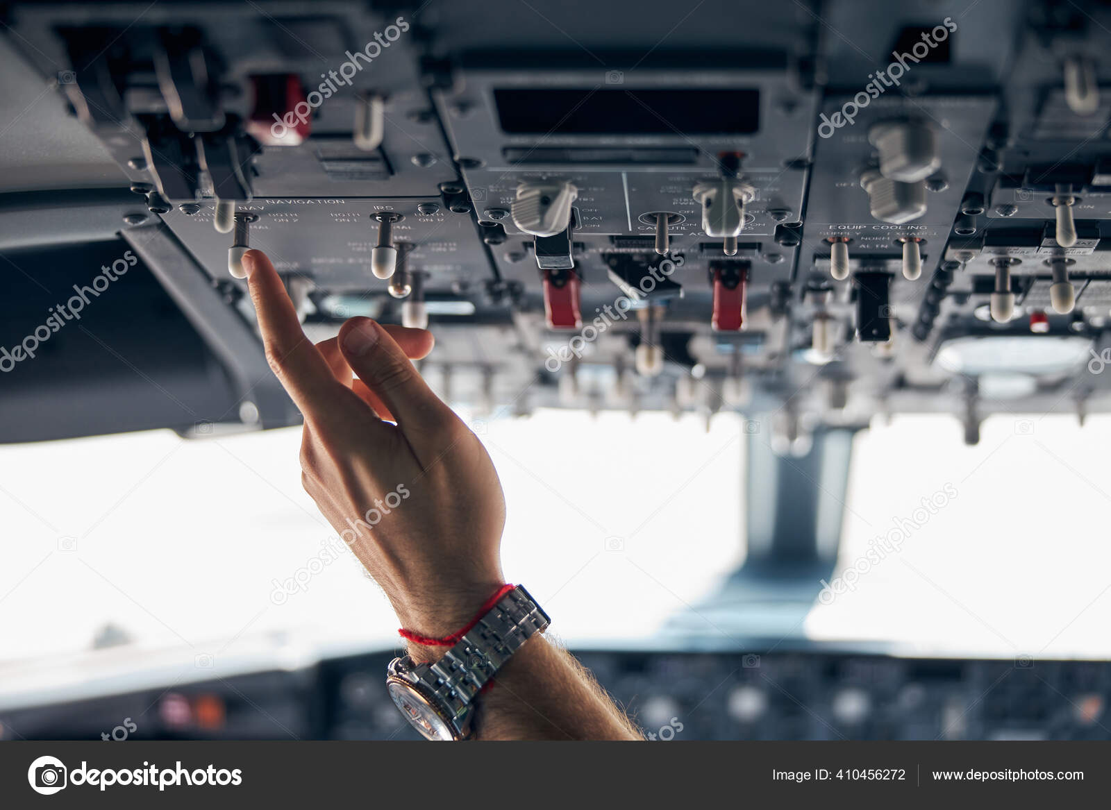 Pilot on plane and crew touching equipment on dashboard — Stock Photo ...