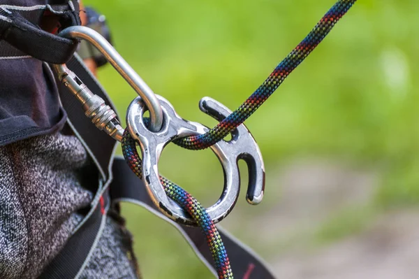 Climbing sports image of a carabiner on a rope - Stock Image - Everypixel