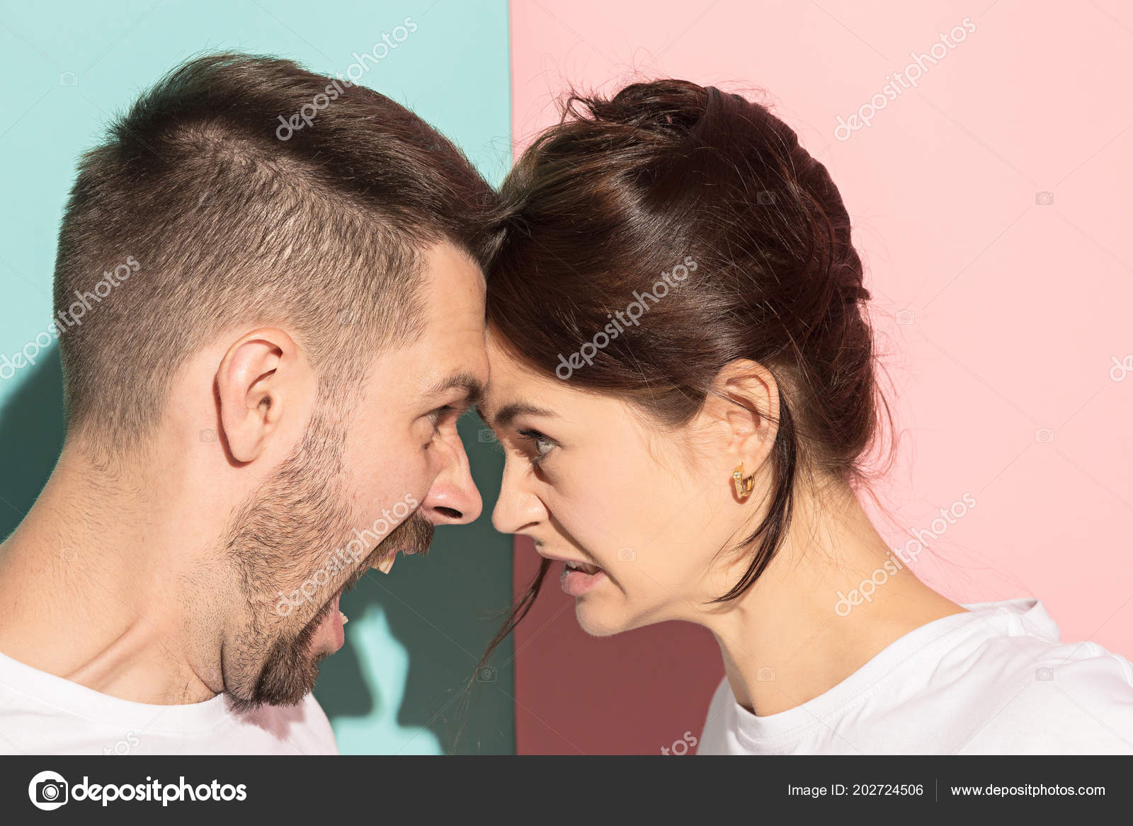 Attractive angry couple fighting and shouting at each other Stock Photo ...