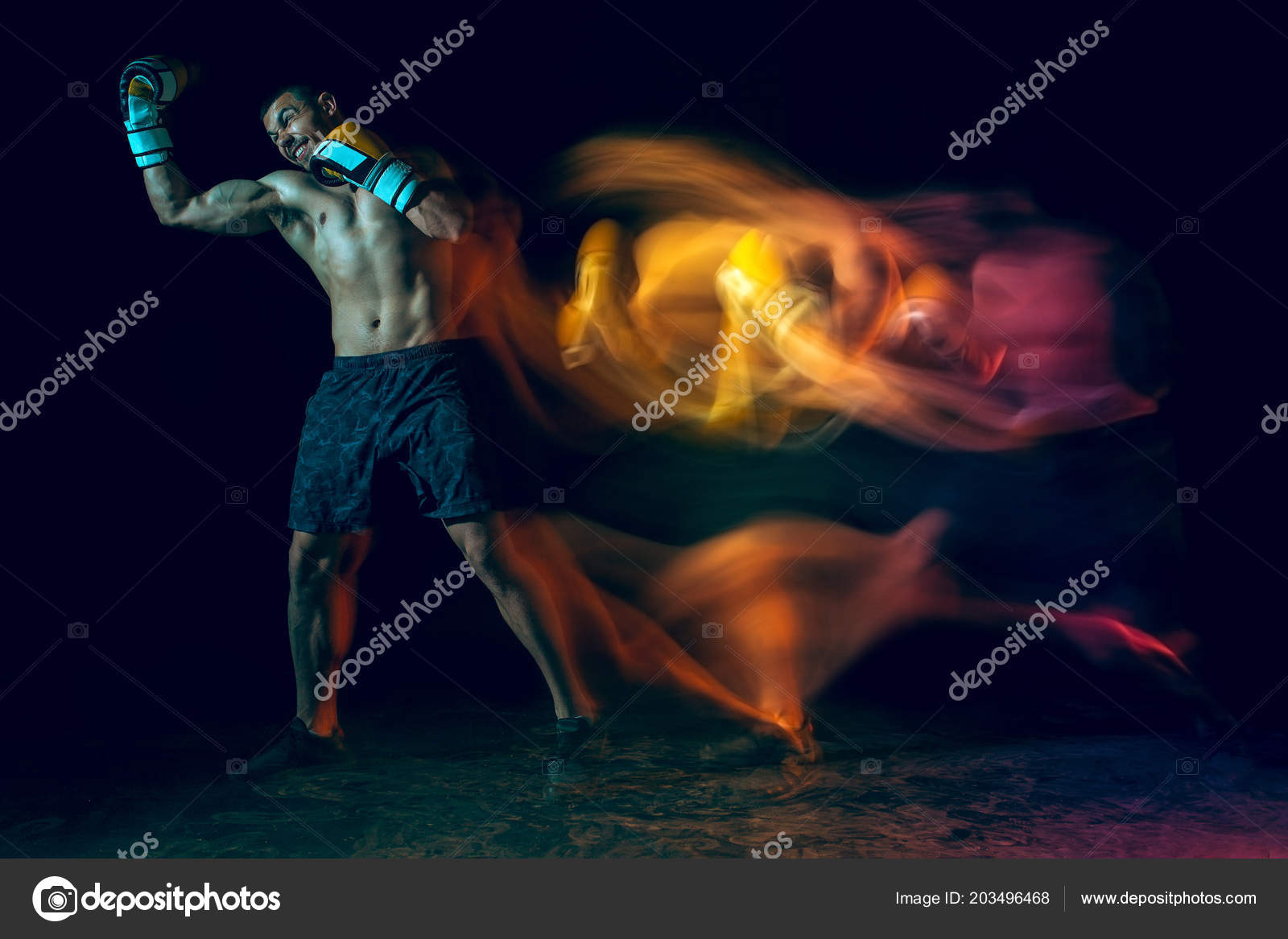 Male boxer boxing in a dark studio Stock Photo by ©vova130555@gmail.com ...