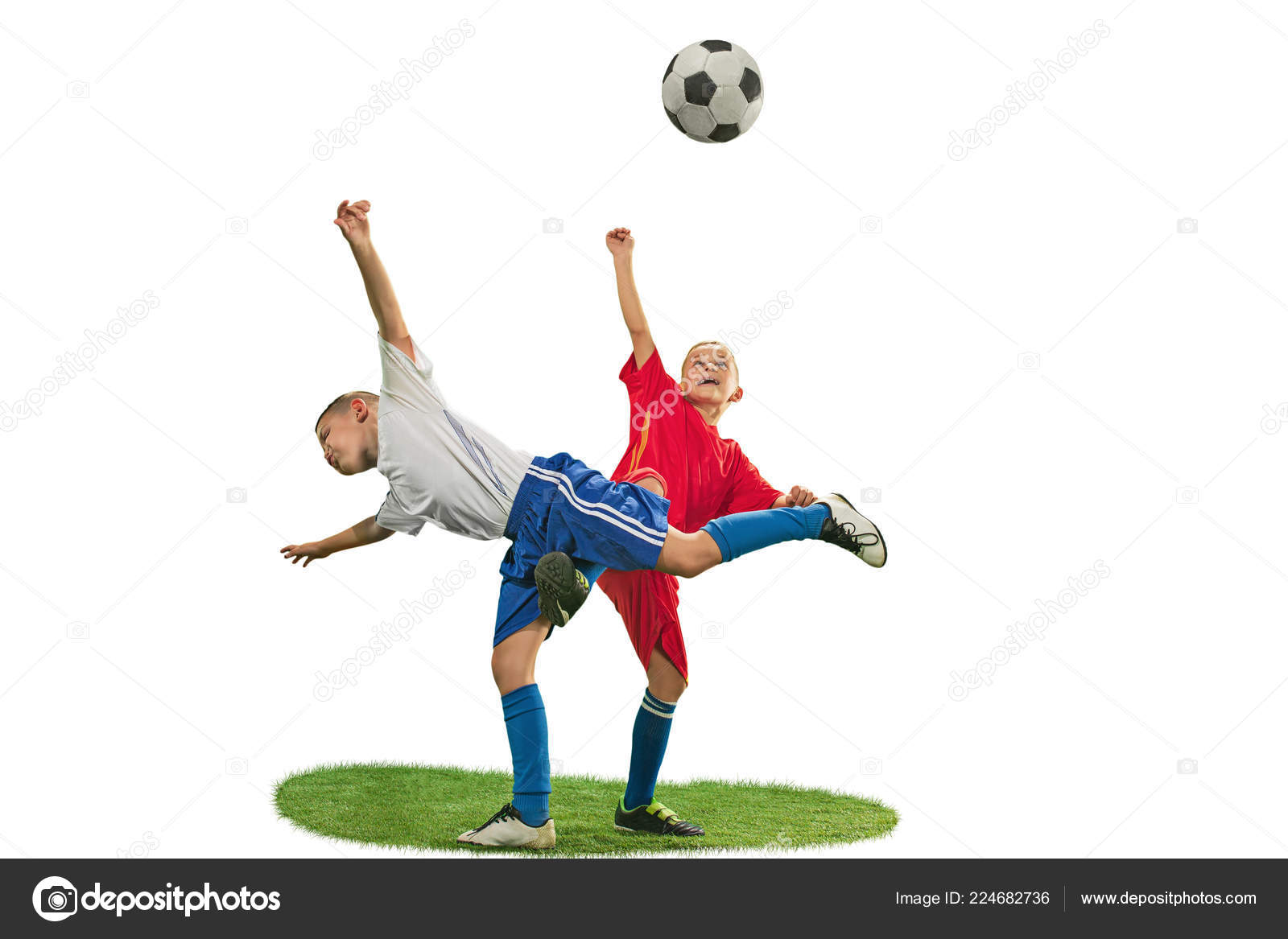 Young boys with soccer ball doing flying kick Stock Photo by ...
