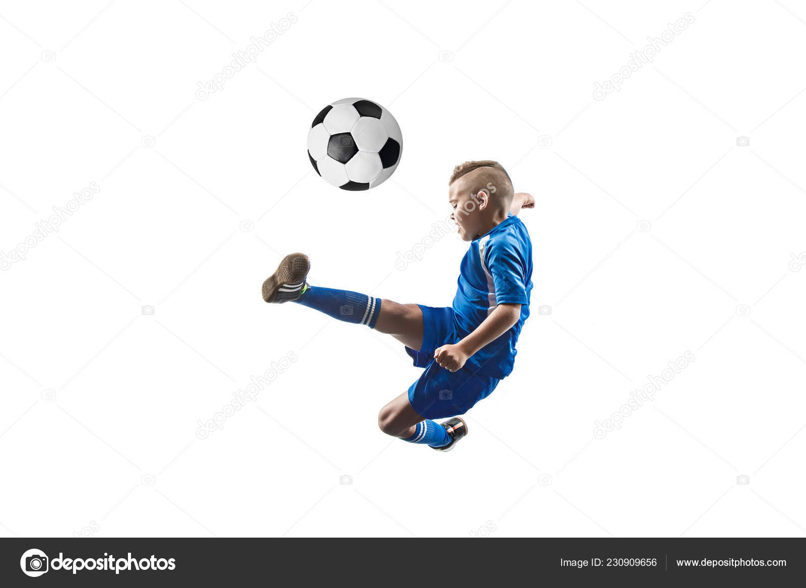 Young boy with soccer ball doing flying kick — Stock Photo © vova130555 ...