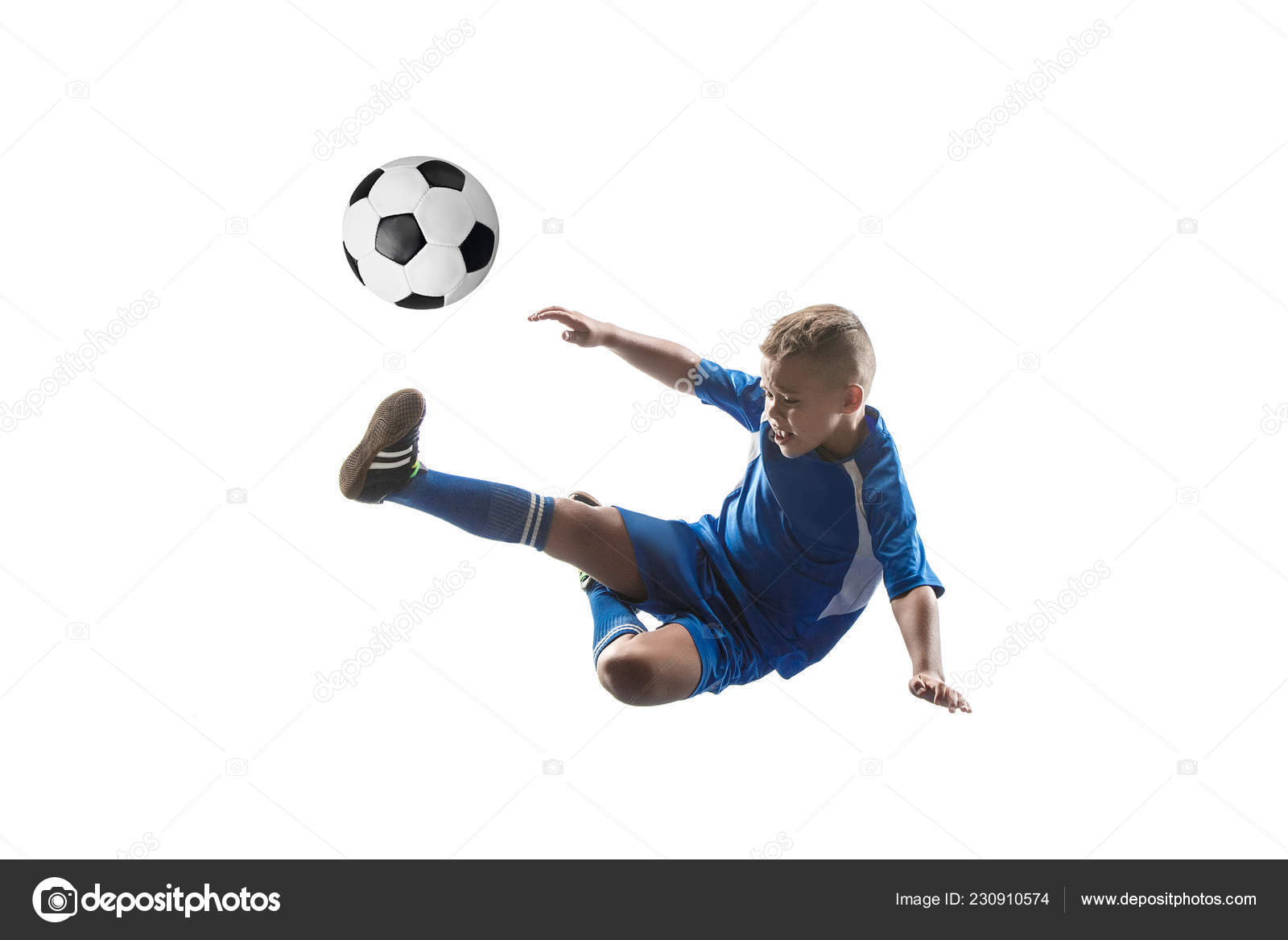 Young boy with soccer ball doing flying kick — Stock Photo © vova130555 ...