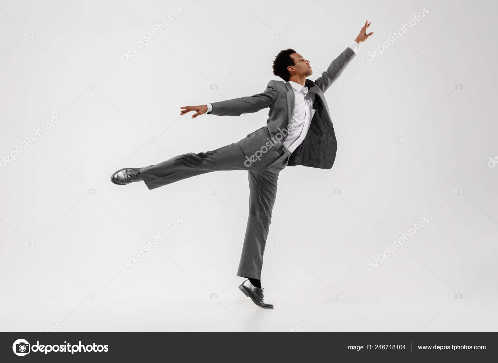Happy businessman dancing isolated on gray studio background — Stock ...