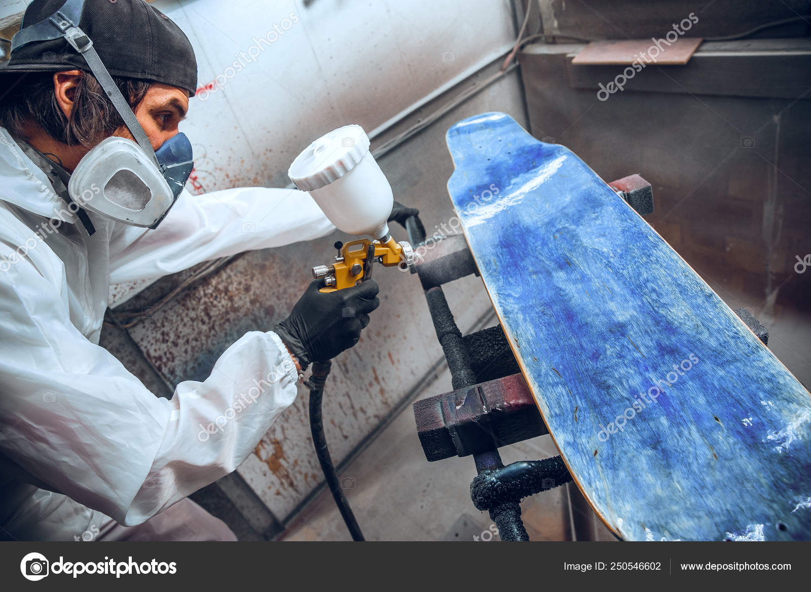 Master painter in a factory Stock Photo by ©vova130555@gmail.com 250546602