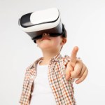 Kid in virtual reality headset Stock Photo by ©AlexNosenko 131365566