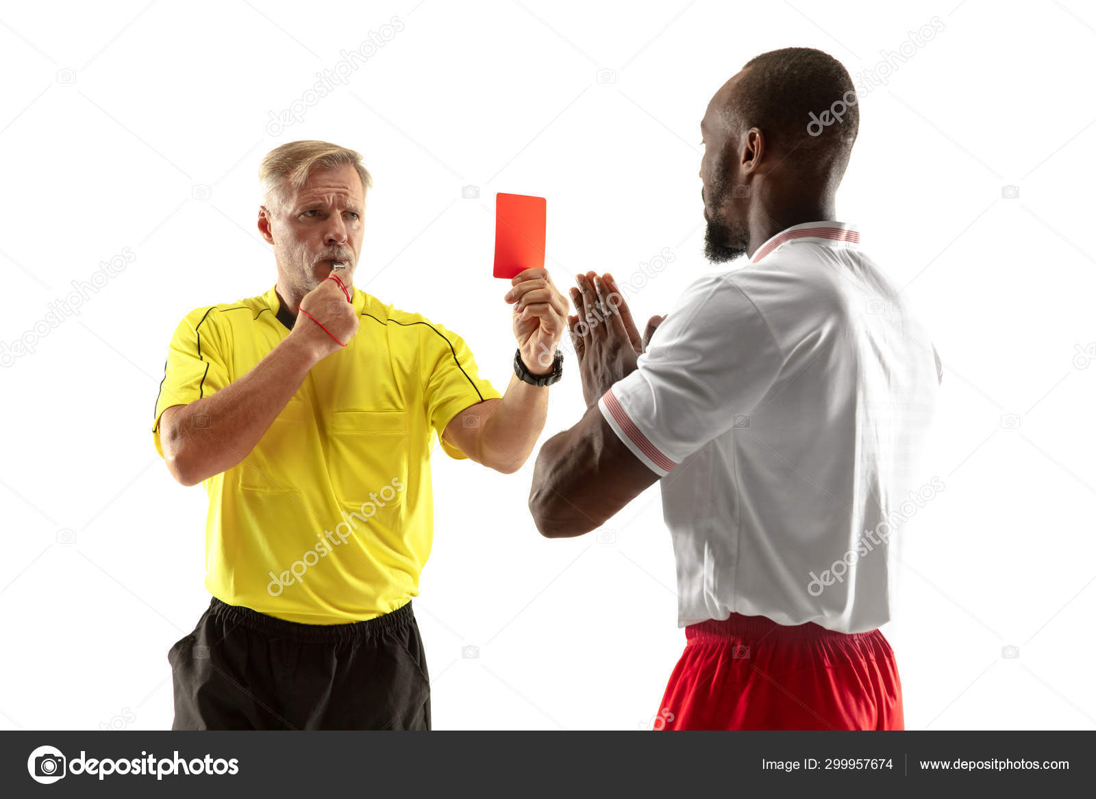 Football referee showing a red card to a displeased player isolated on ...