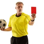 Football referee showing a red card to a displeased player isolated on ...