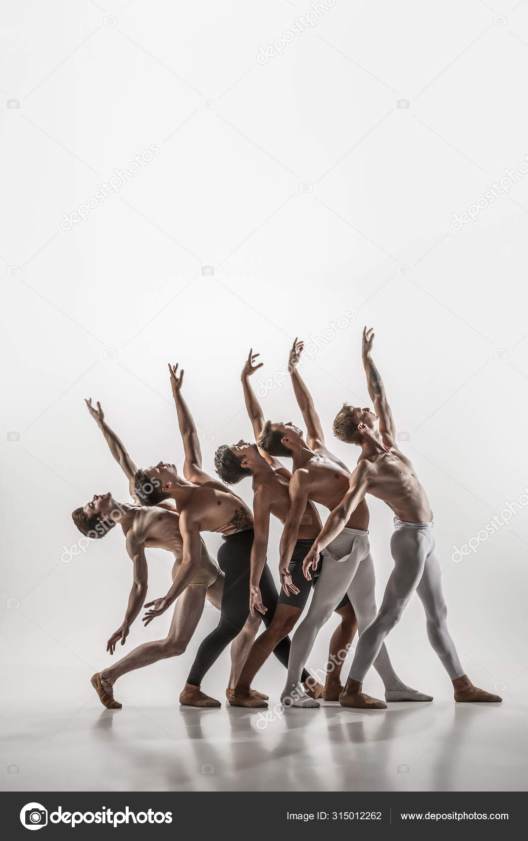 The group of modern ballet dancers. Contemporary art ballet. Young ...