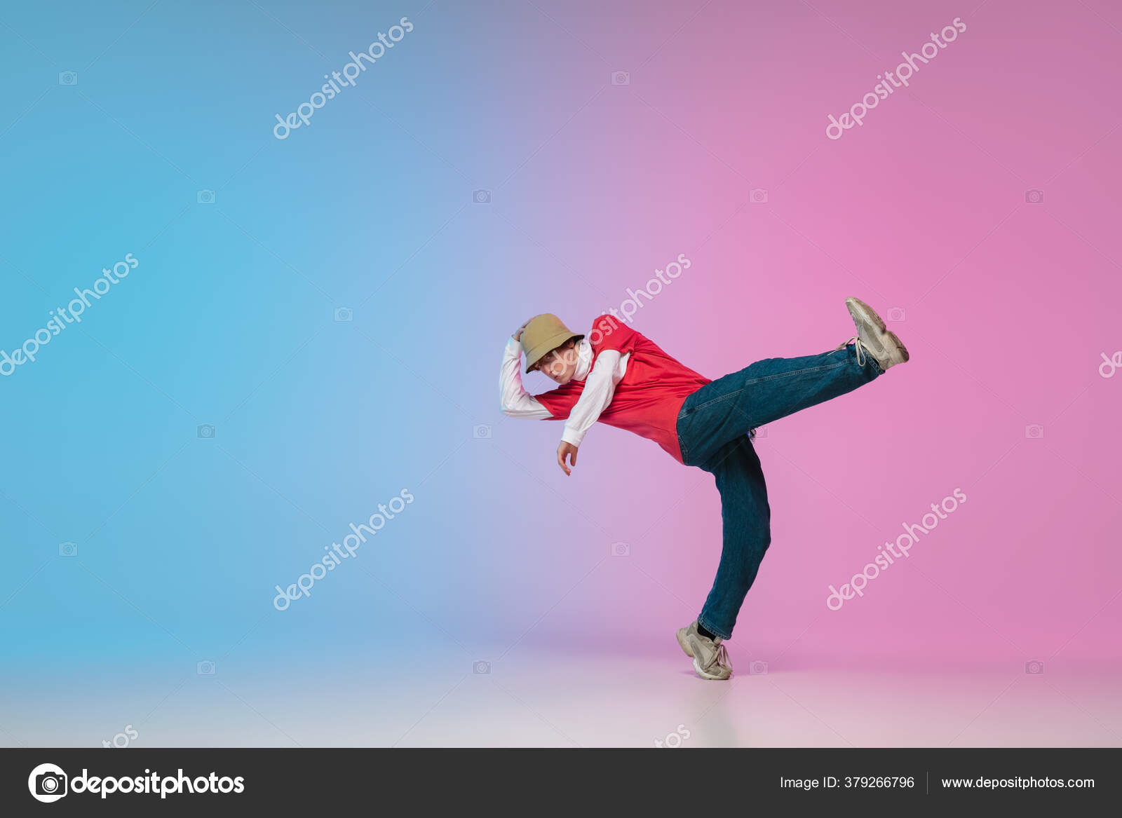 Boy dancing hip-hop in stylish clothes on gradient background at dance ...