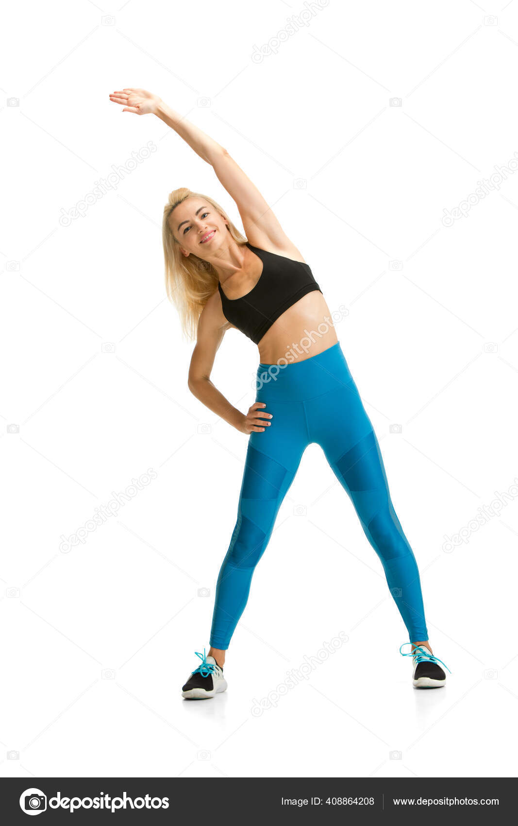 Beautiful female fitness coach practicing isolated on white studio ...