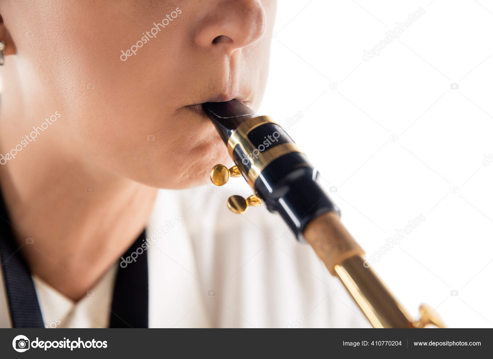 Close up woman playing saxophone isolated on white studio background ...
