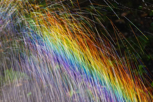Splashing water. Abstract water rainbow background. - Stock Image ...