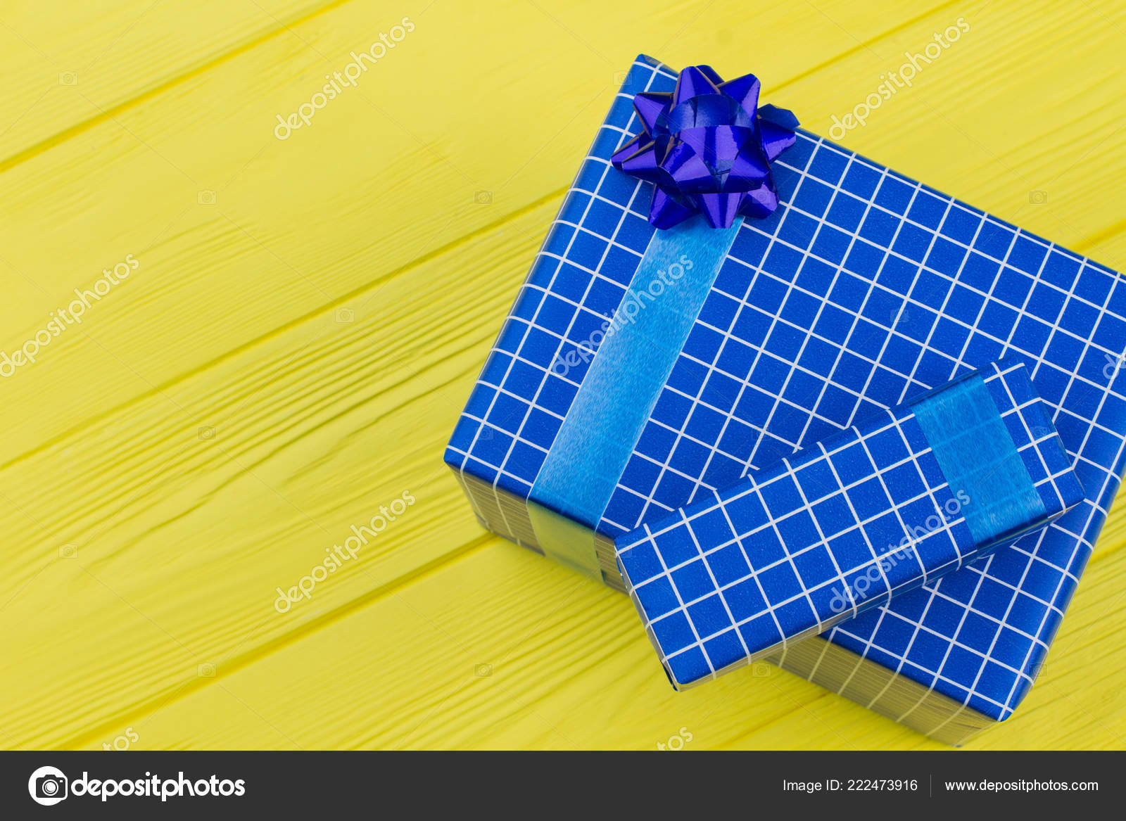 Gift boxes wrapped in dark blue paper. Stock Photo by ©Denisfilm 222473916