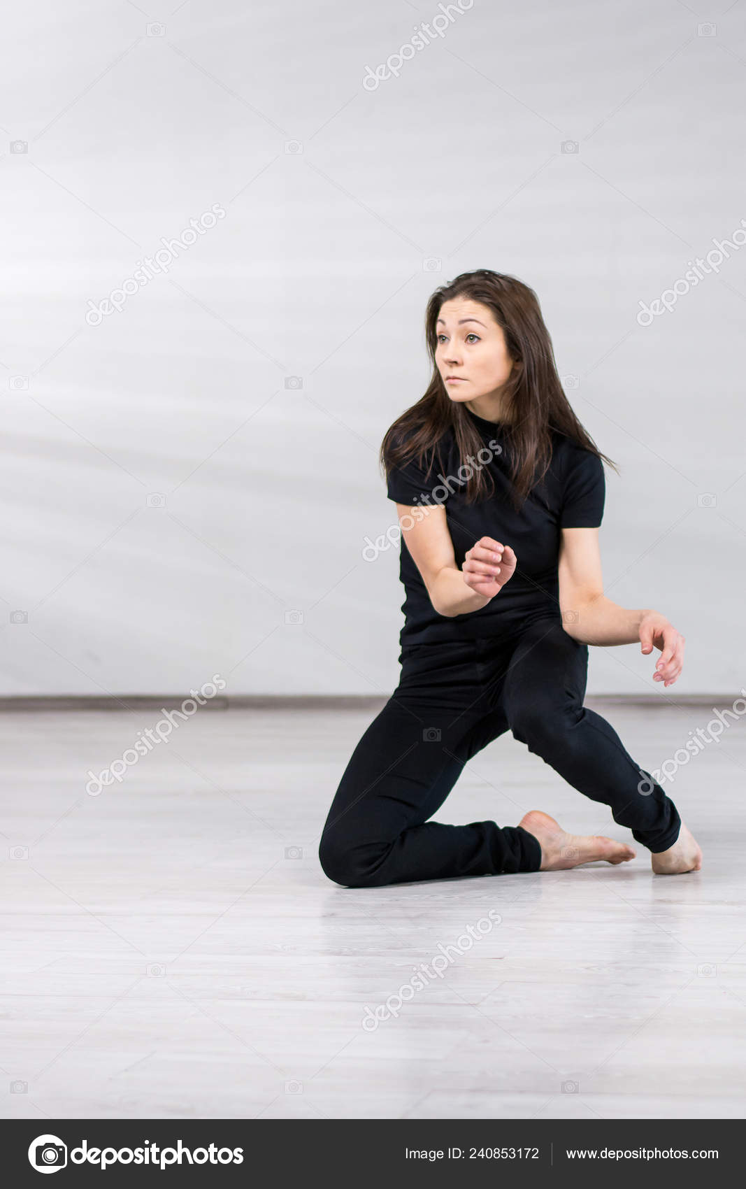 Pretty dancer on studio background. Stock Photo by ©Denisfilm 240853172