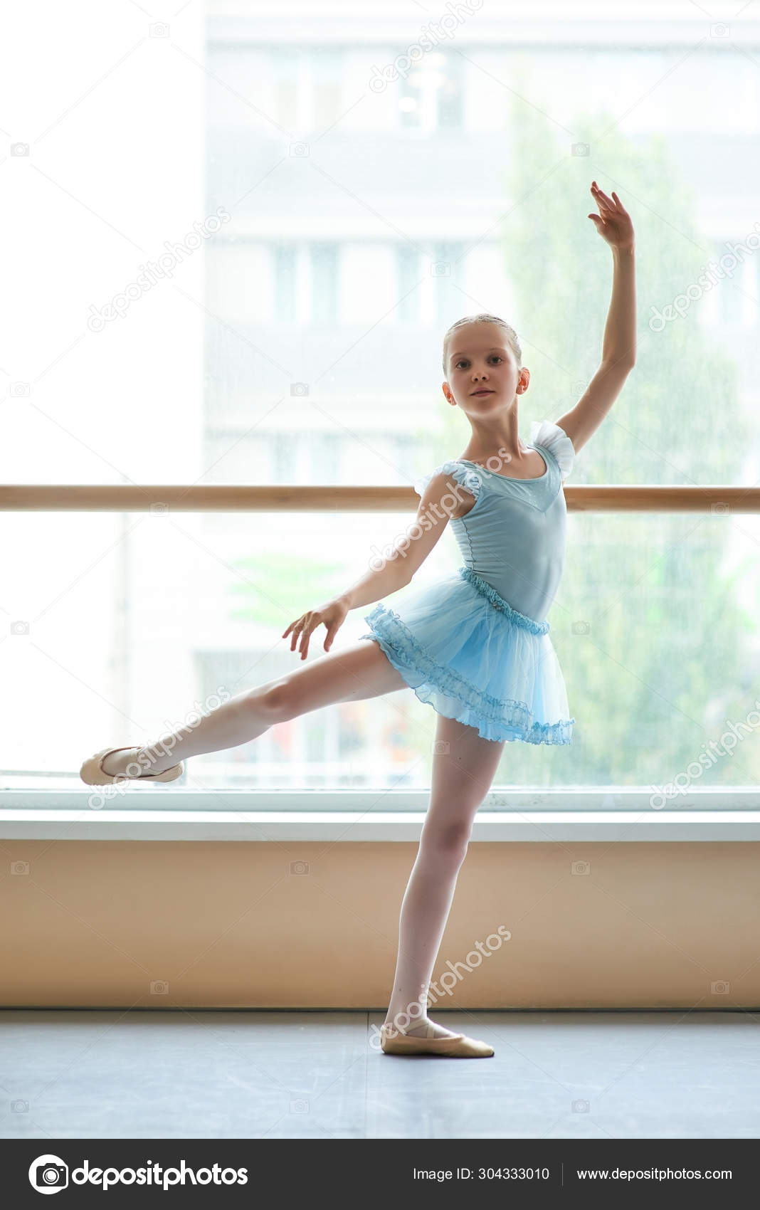 Beautiful girl posing in ballet studio. Stock Photo by ©Denisfilm 304333010